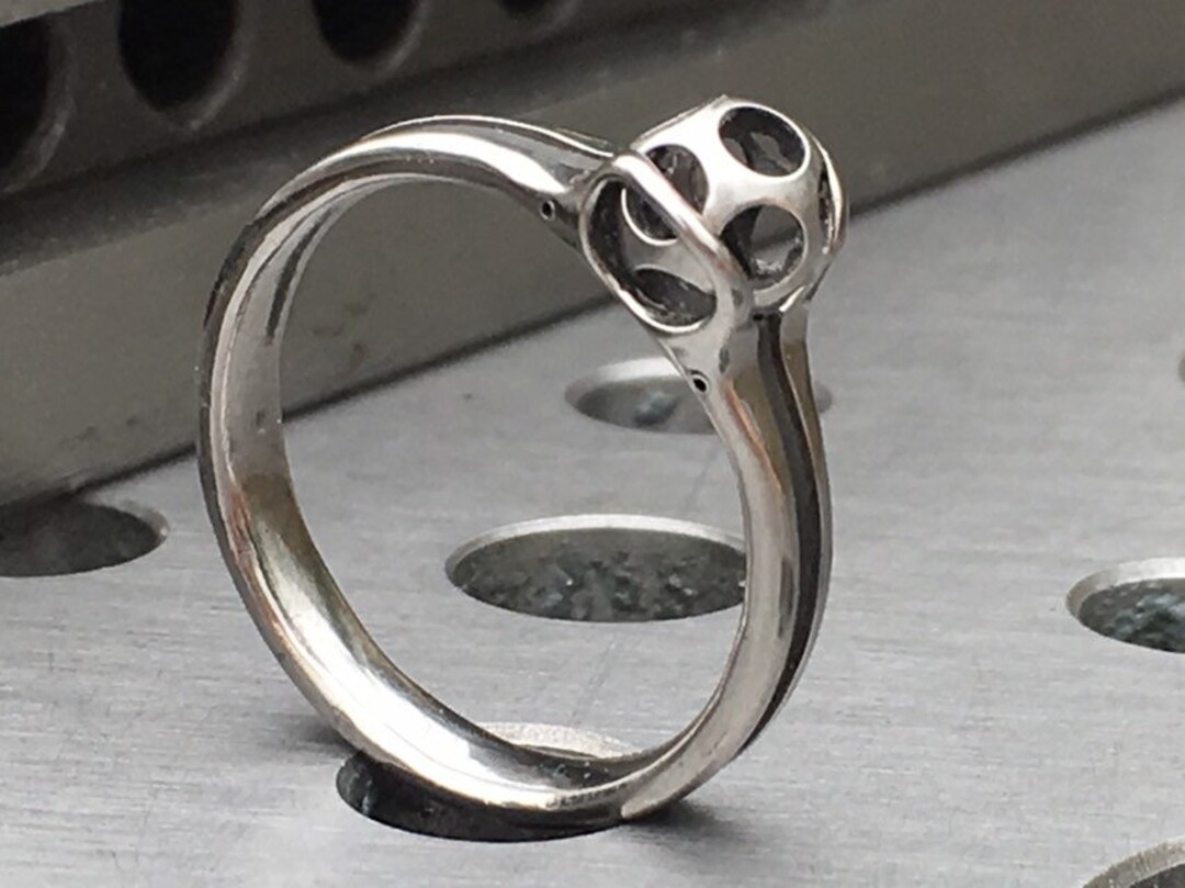 Pure Motion - A Floating Titanium Sphere in a Slim, Elegant Titanium ...