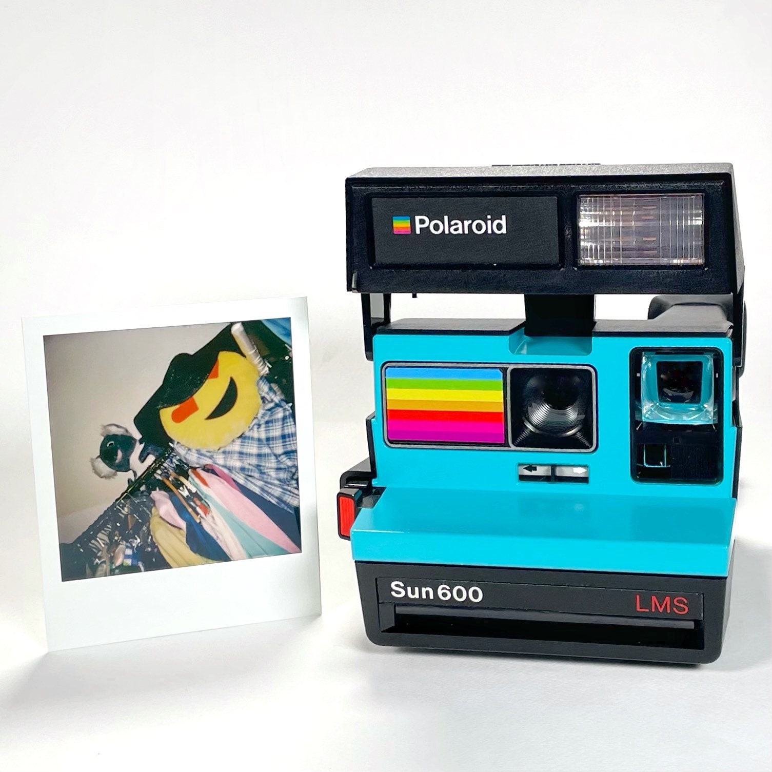 Polaroid Sun 600 with Upcycled Turquoise Blue and rainbow face ...