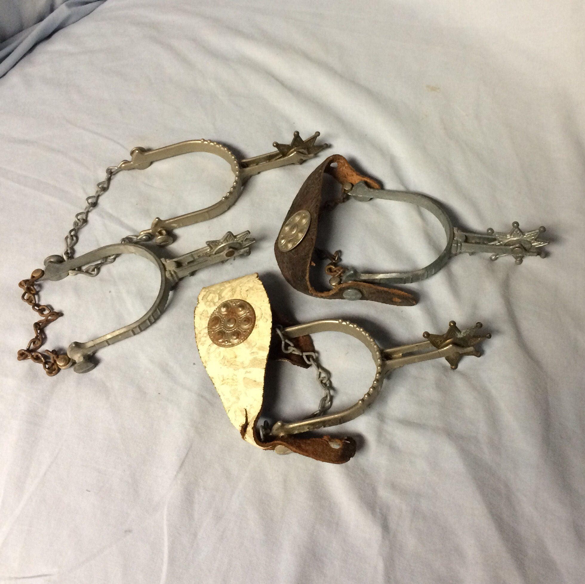Two sets of Toy Metal Spurs with Embossed Leather Straps, 1950's