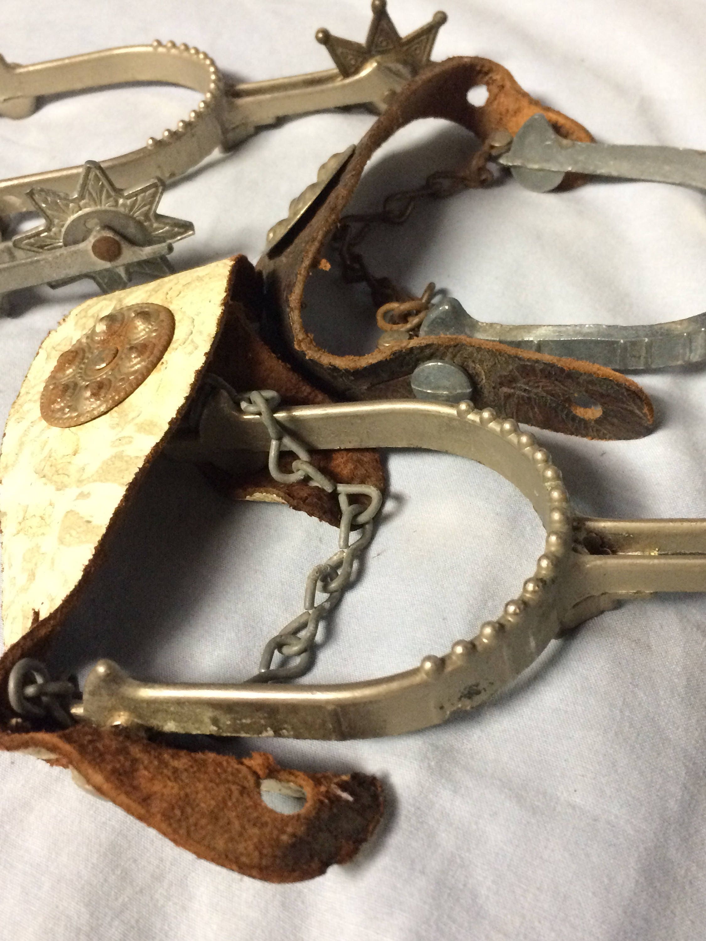 Two sets of Toy Metal Spurs with Embossed Leather Straps, 1950's
