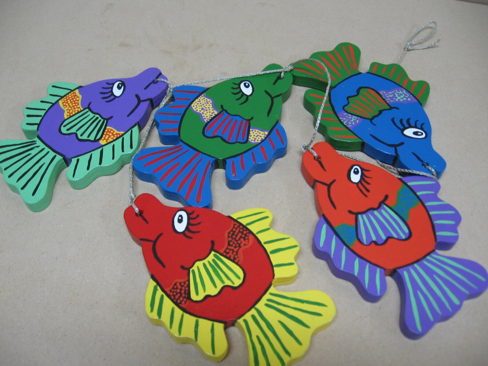 5 Colorful Wooden Fish on a String. - Etsy