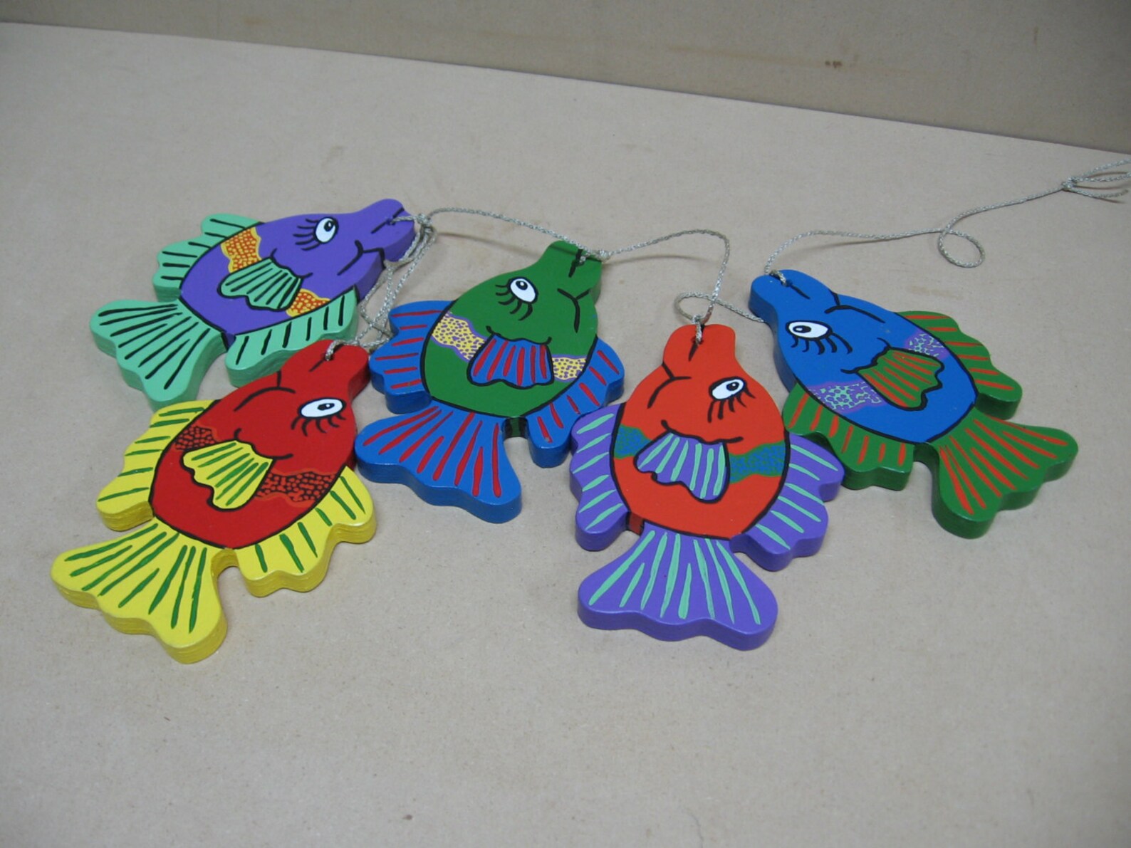 5 Colorful Wooden Fish on a String. - Etsy