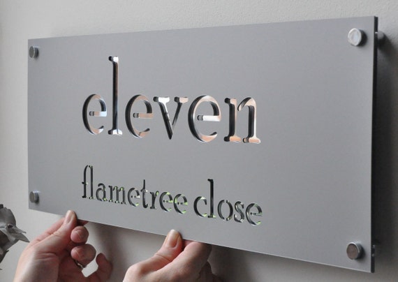 What font is used on this house door number sign? : r/identifythisfont