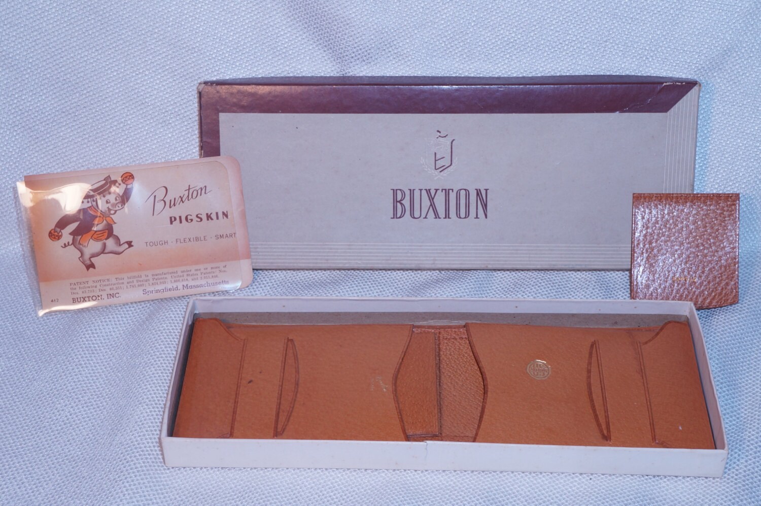 1940's Buxton stitchless pigskin wallet embossed with U.S. Motors logo ...