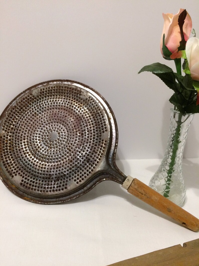 Flat Metal Utensil With Wooden Handle, Round Utensil With Patina Used ...