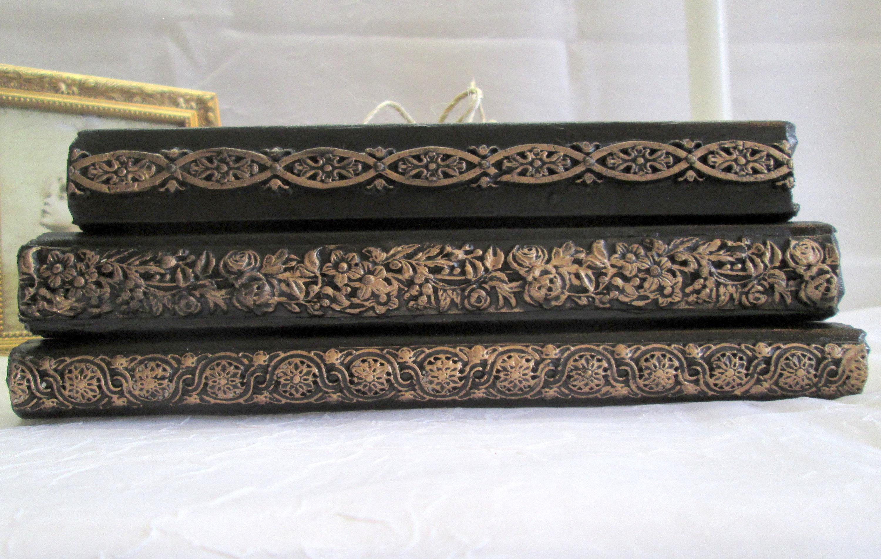 Decorative Black Book Stack With Hand Cast Clay Motifs , Beautiful on ...