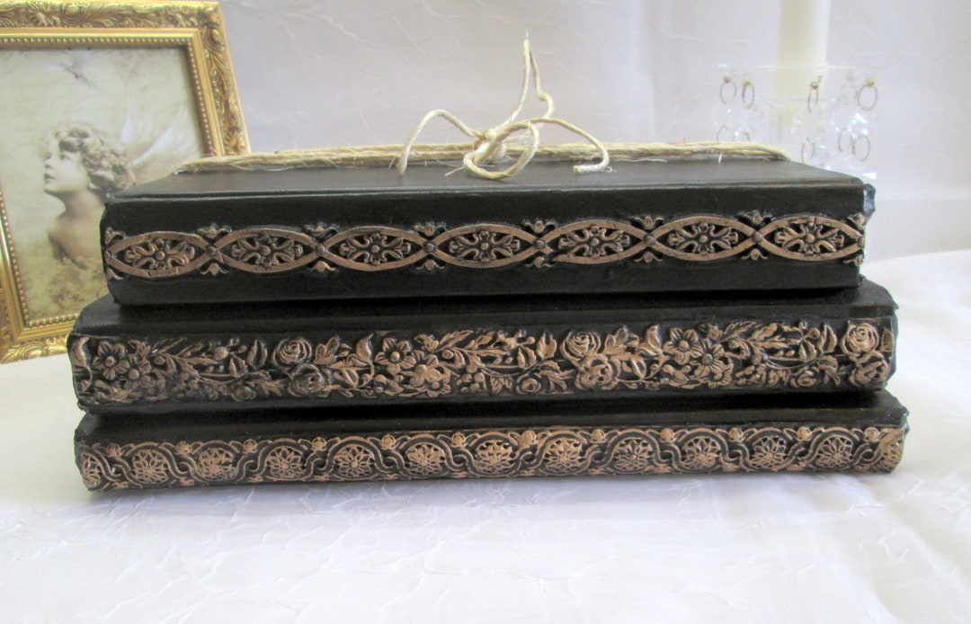 Decorative Black Book Stack With Hand Cast Clay Motifs , Beautiful on ...