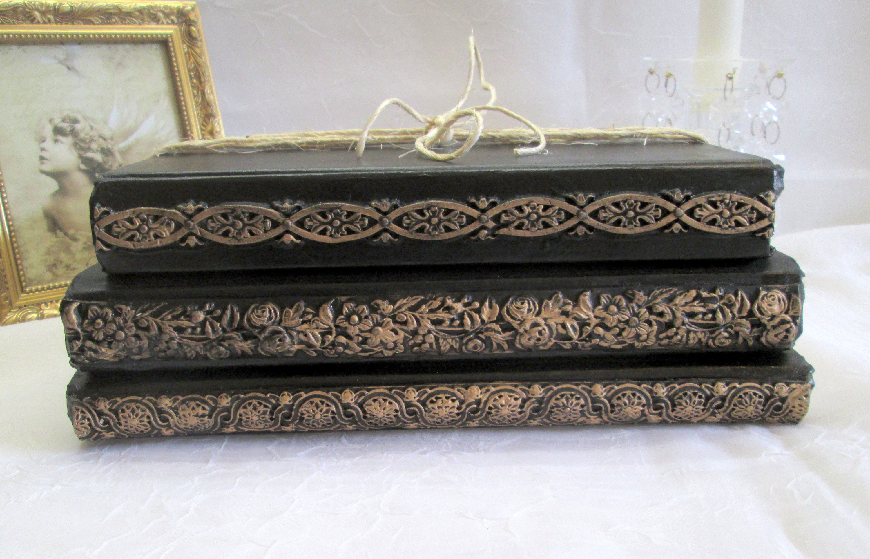 Decorative Black Book Stack With Hand Cast Clay Motifs , Beautiful on ...