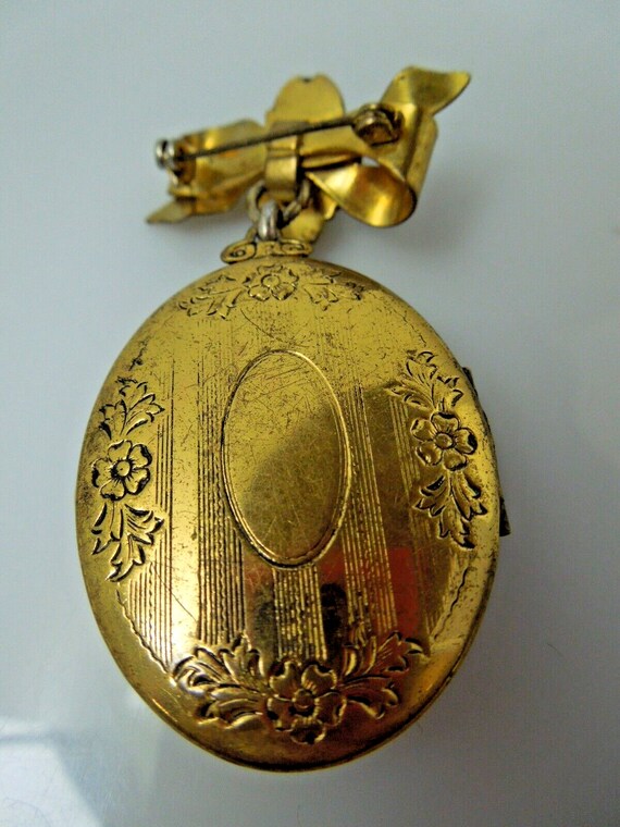 s884 Vintage Large Gold Coro Locket Rhinestones Bow L… - Gem