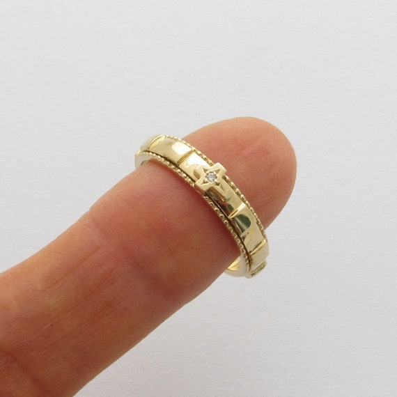 Spinning rosary ring store