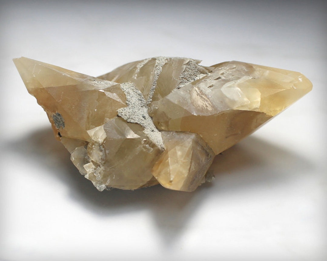 Translucent Amber Scalenohedral Calcite Crystals, on Thin Sandy-gray Matrix, From Reynolds Co ...