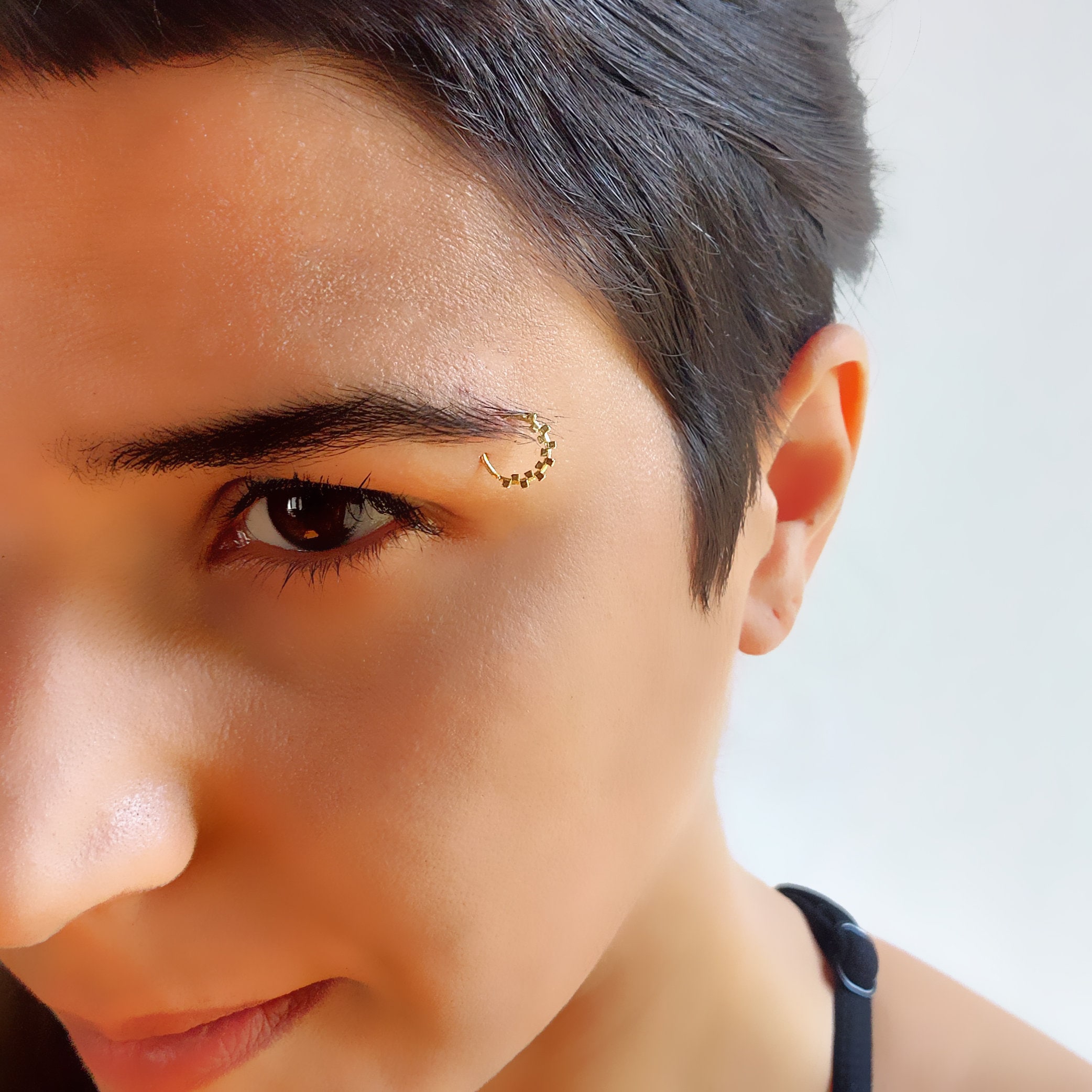 Double Horizontal Eyebrow Piercing