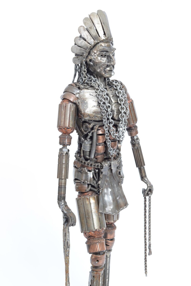 Native American Indian Walking With a Snake in One Hand and a Stick in ...