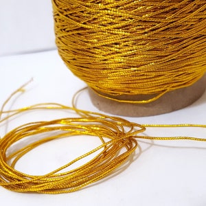 Approx 0.8mm Width 250 Yds 228 Mtr Gold Stretch Metallic Elastic Thread ...