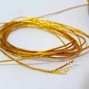 Approx 0.8mm Width 250 Yds 228 Mtr Gold Stretch Metallic Elastic Thread ...
