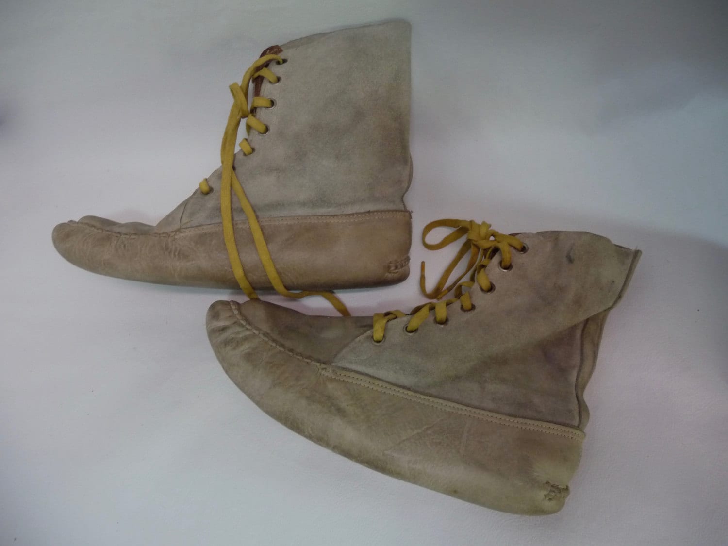 Moccasin man laced leather skin for snowshoeing. Quebec. Canada. 60-70 ...