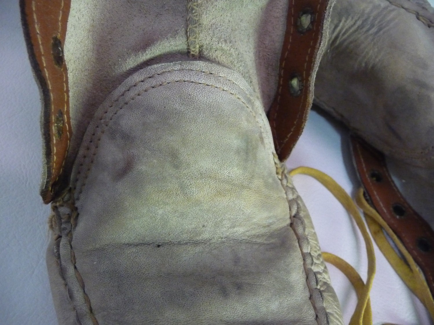 Moccasin man laced leather skin for snowshoeing. Quebec. Canada. 60-70 ...