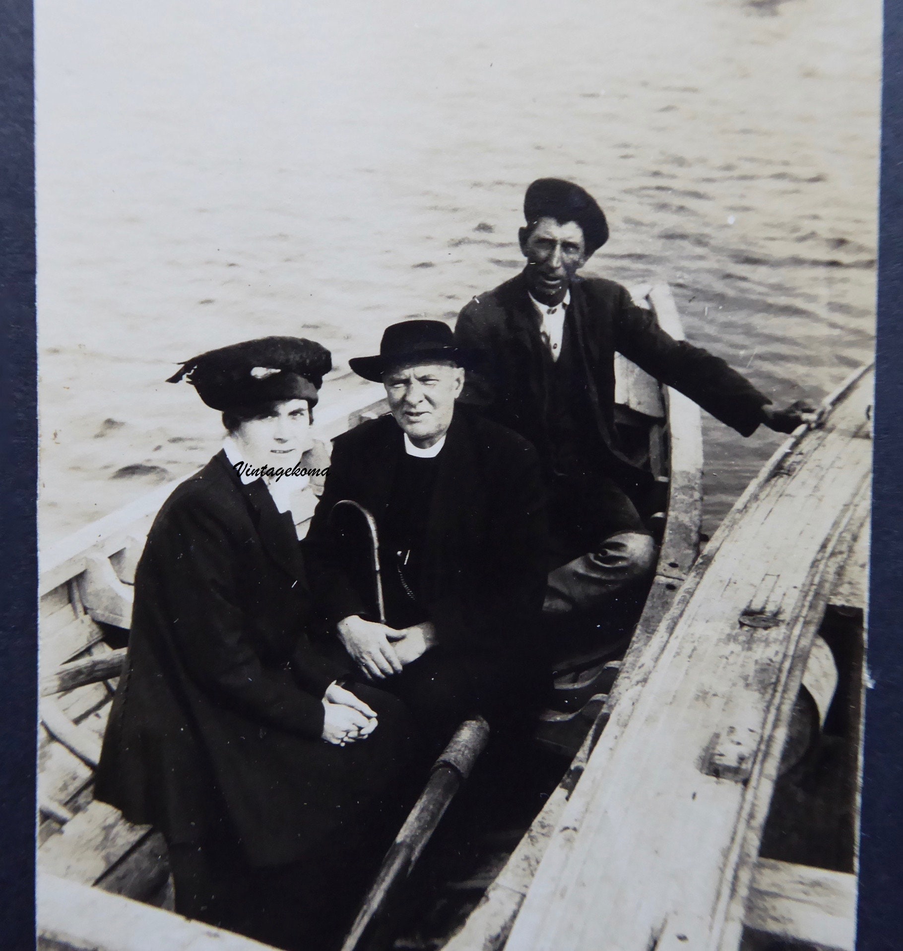 Ancient curate photo woman sitting boatman 1910. Boat. Wooden chaloupe ...