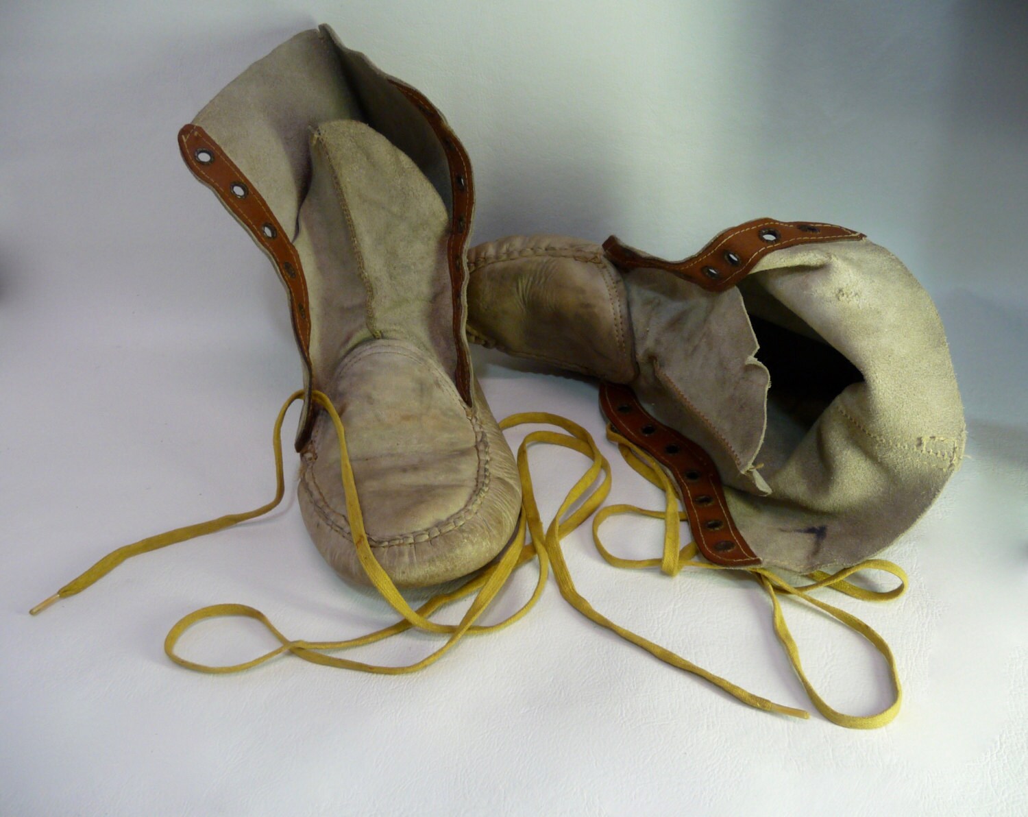 Moccasin man laced leather skin for snowshoeing. Quebec. Canada. 60-70 ...