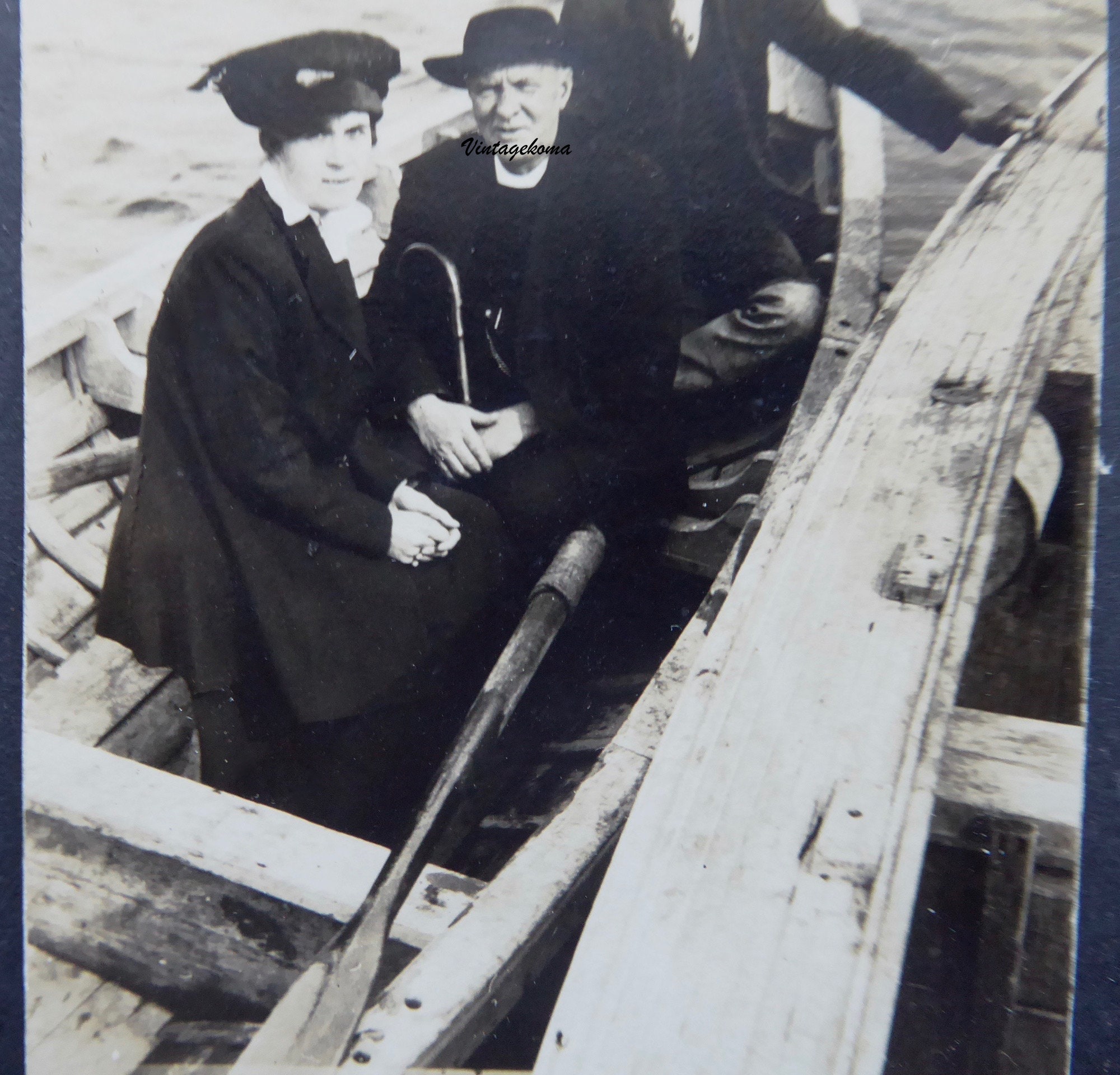 Ancient curate photo woman sitting boatman 1910. Boat. Wooden chaloupe ...