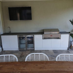Outdoor Kitchen Concrete Benchtops With Black Weatherproof Cabinetry ...