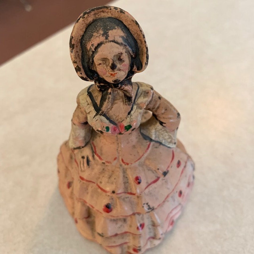 Cast Iron Victorian Lady With Bonnet and Pink Frilly Dress National ...