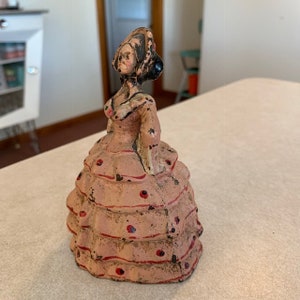 Cast Iron Victorian Lady With Bonnet and Pink Frilly Dress National ...