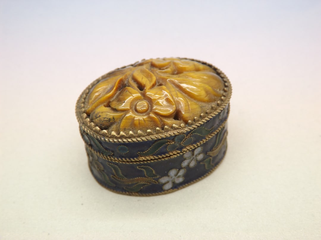 A Fine Oval Oriental Pill Box Enamelled Floral Decoration on a Goldtone ...