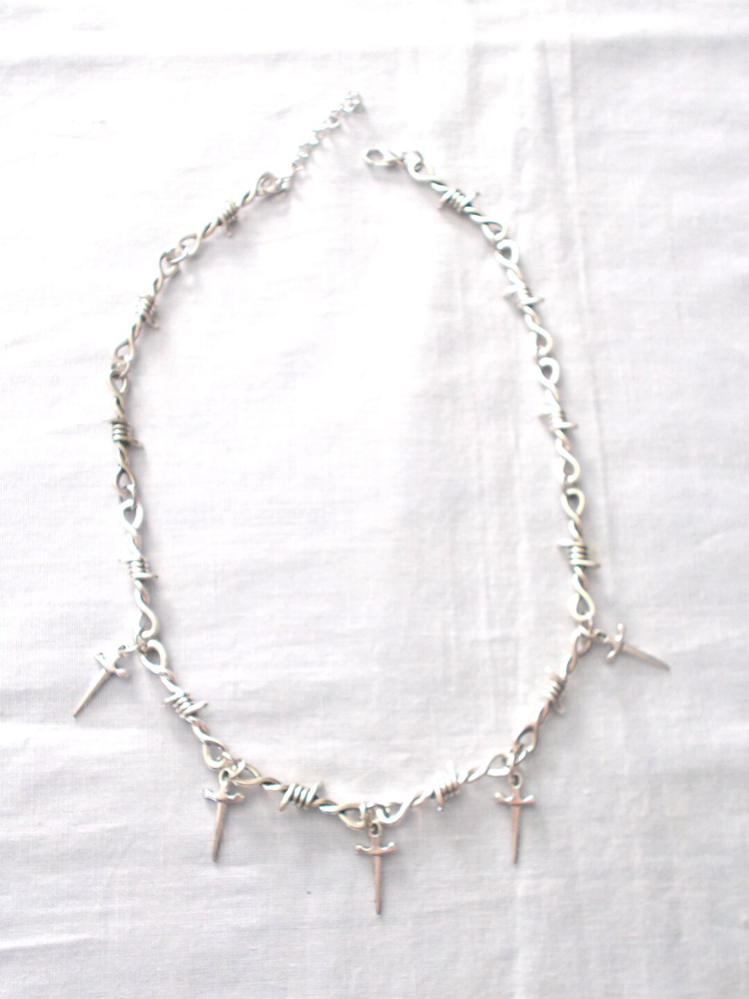 5 Sword Charms on BARBED WIRE / Barb Wire / Barbwire Barb Twist Chain ...