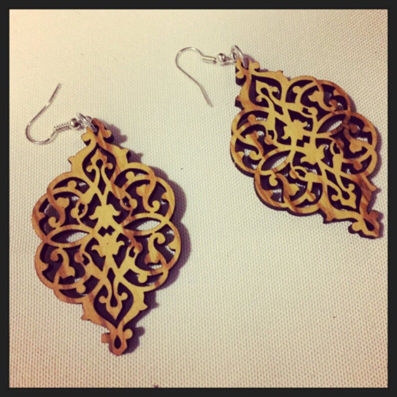 Arabesque olivewood earrings | Etsy