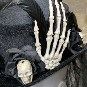 Halloween Skeleton Hand With Mini Skull Head Side Feather Party Black ...