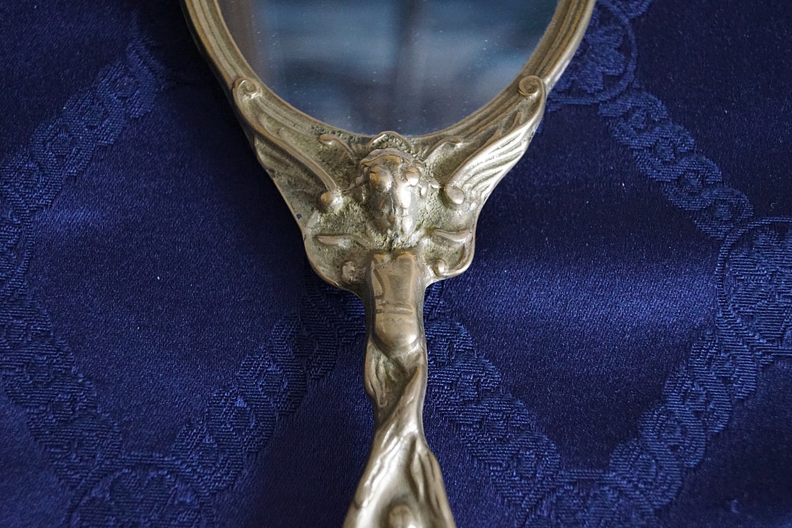 Vintage brass mirror with angels decor. | Etsy