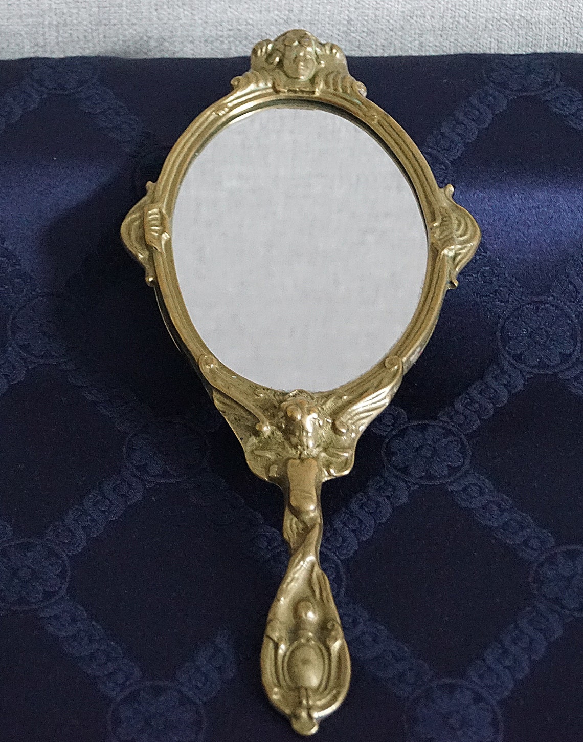 Vintage brass mirror with angels decor. | Etsy