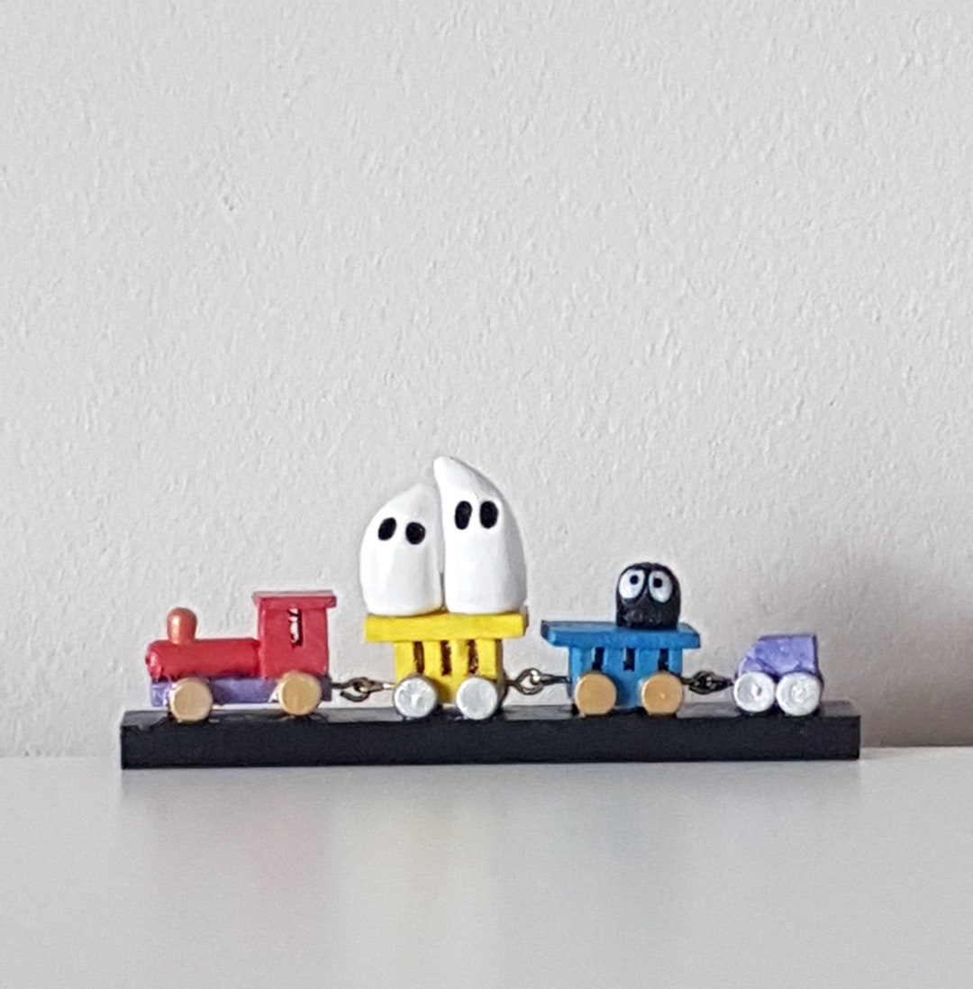 Art-boo-boo on a Train - Clay Ghost Figurines on a Wood Train ...