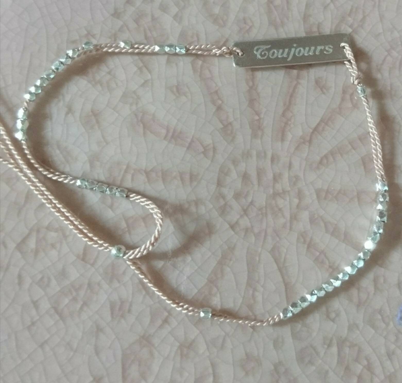 Toujours bar tag bracelet in sterling silver on silk cord,