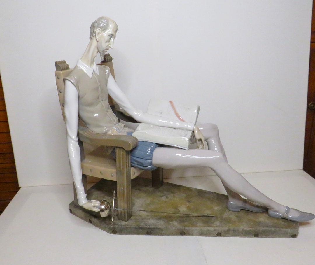 LLADR0 Don Quixote Tired and Defeated Sitting in a Chair Sword in Hand ...