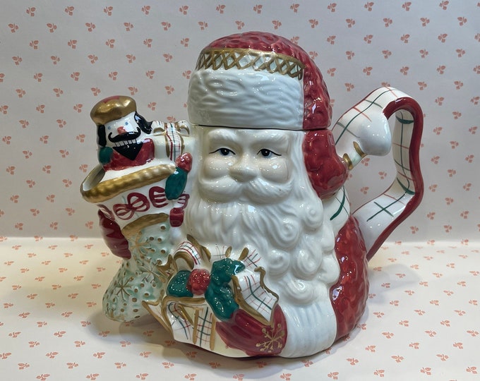 SANTA TEA Potavonsanta Holding a Nutcracker, Stocking and ...