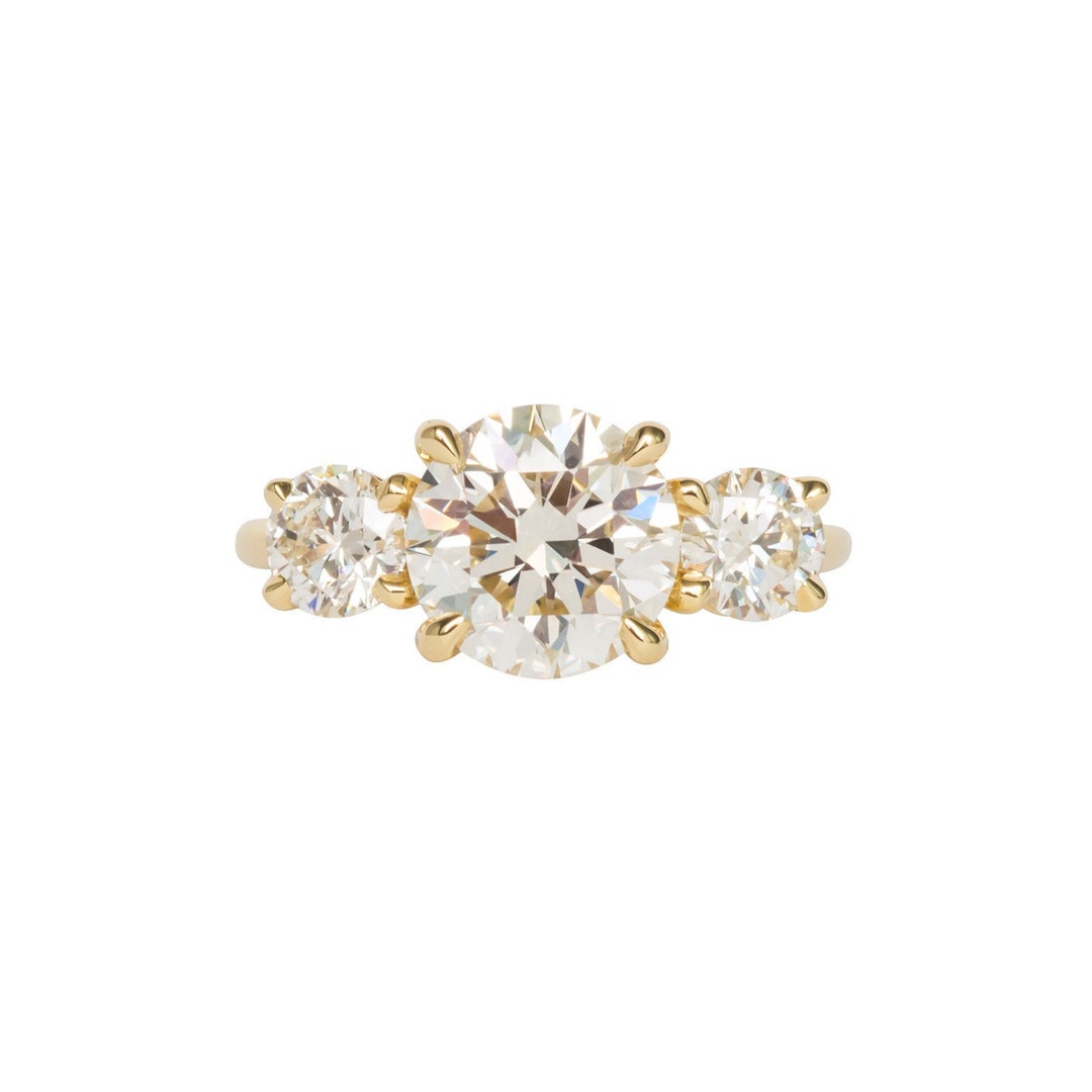 3 Stone Solitaire Engagement Ring Setting on A Thin Yellow Gold Band ...
