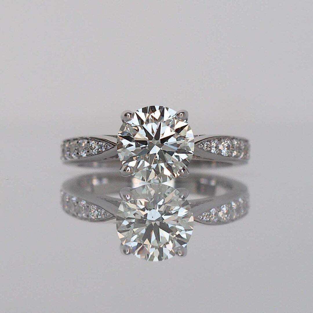 Round Brilliant Cut Solitaire Engagement Ring With Channel Set Tapered ...