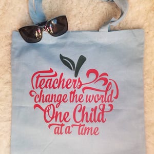 Cute teachers Change the World One Child at a Time Canvas Tote Bag ...