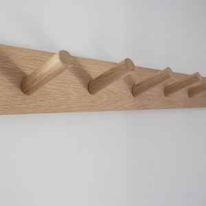 Dowel Peg Rail With Straight Edge by TOMAZIN | Oak Hook Board, Coat Hat ...
