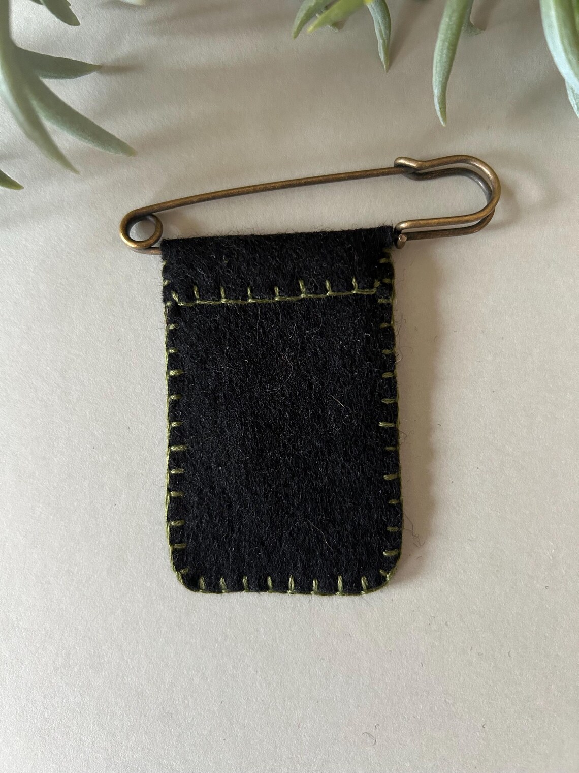 A Handmade Charcoal Grey Felt Kilt Pin Brooch With Embroidered Flower ...