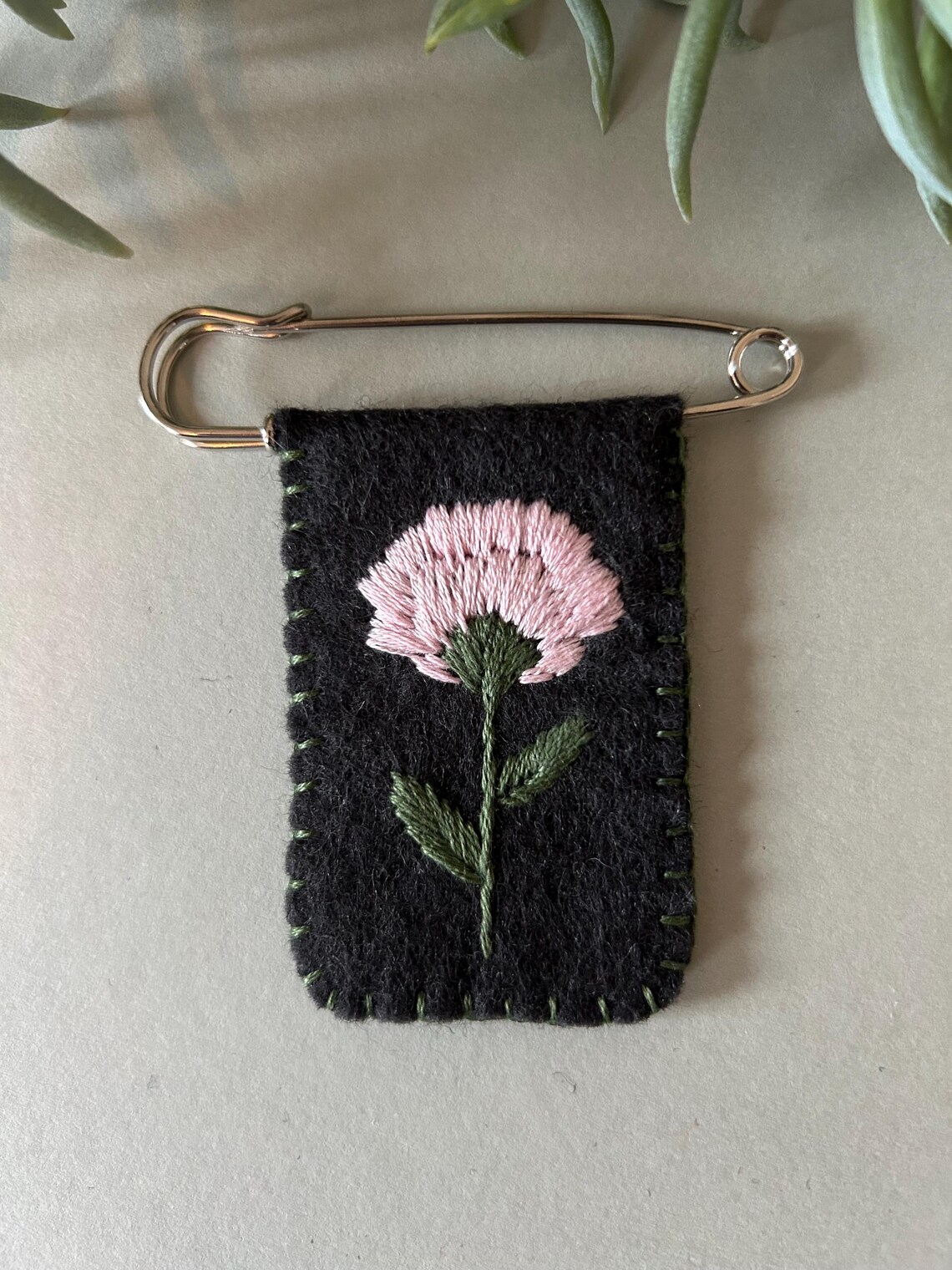 A Handmade Charcoal Grey Felt Kilt Pin Brooch With Embroidered Flower ...