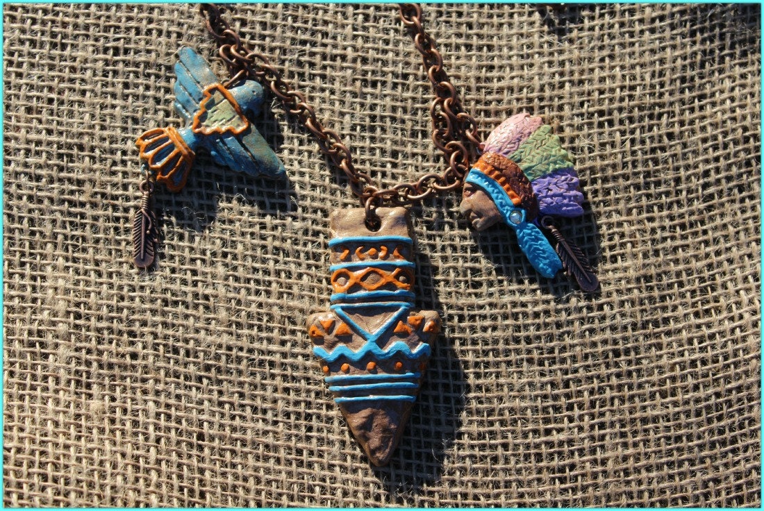 Clay arrowhead, clay Indian head and clay Spirit bird on a 36" antique ...