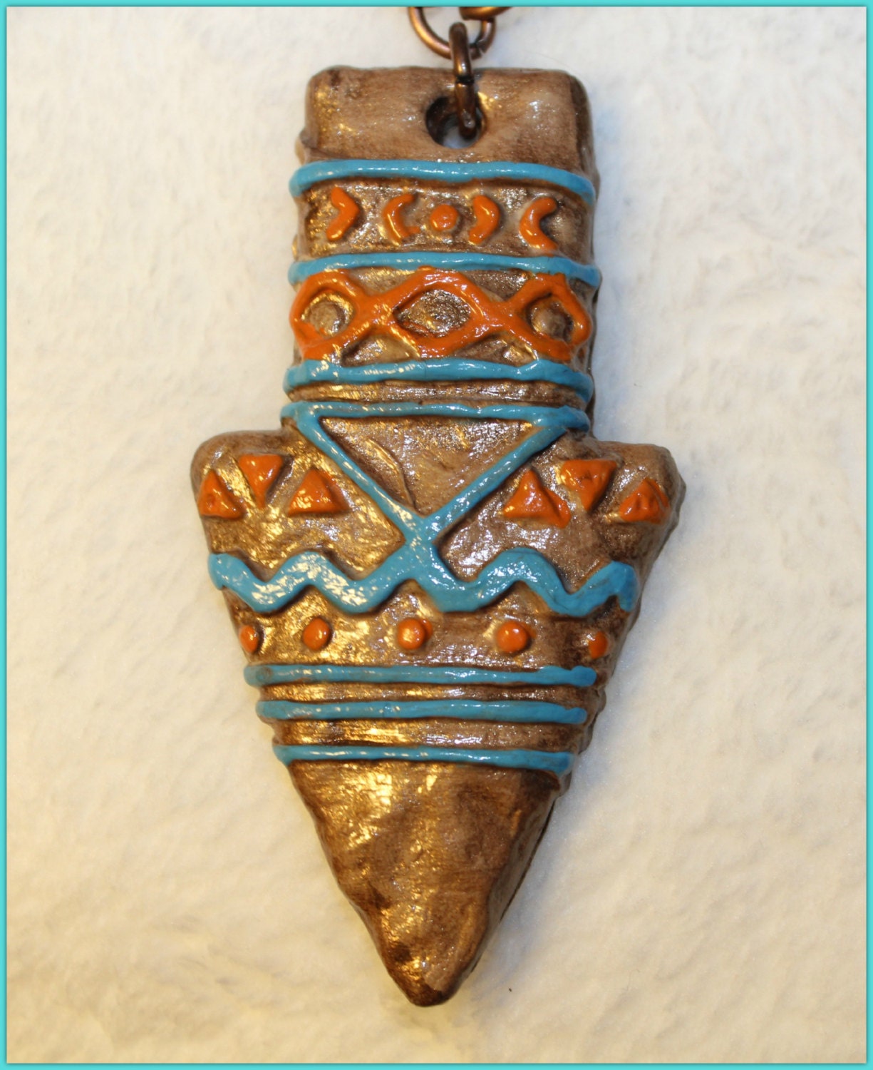 Clay arrowhead, clay Indian head and clay Spirit bird on a 36" antique ...