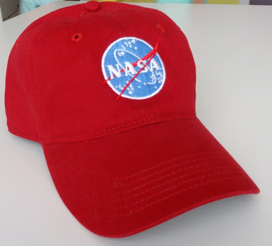 Nasa insignia embroidered red Hat Tomorrowland Casey Newton