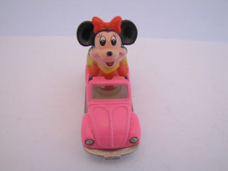 A Vintage Novelty Hot Pink Convertible Volkswagon Beetle Driven By
