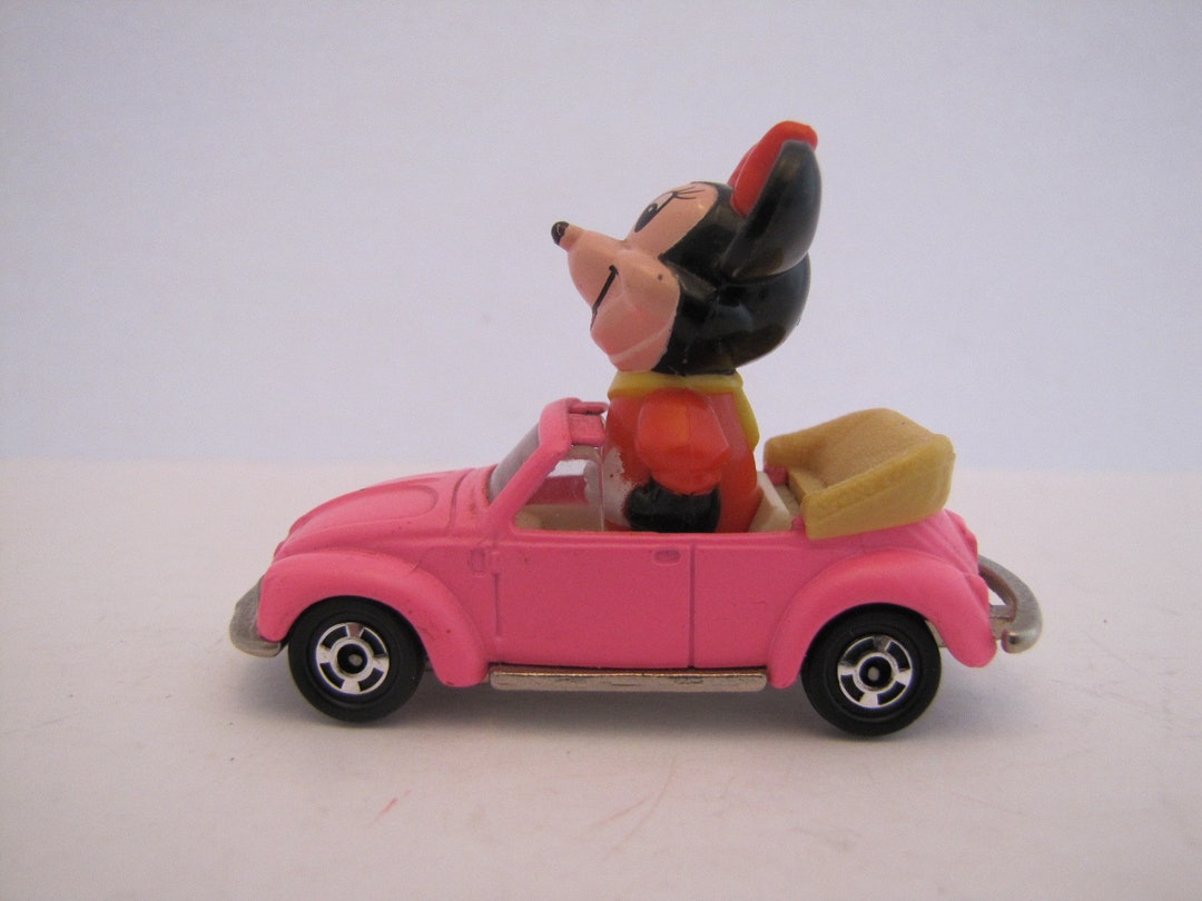 A Vintage Novelty Hot Pink Convertible Volkswagon Beetle Driven by ...