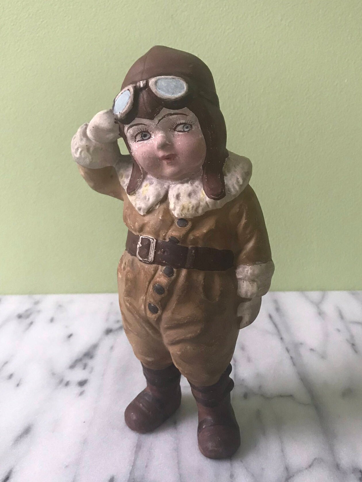 1930s Female Aviator Saluting in Sherpa Lined Flight Suit With Leather ...