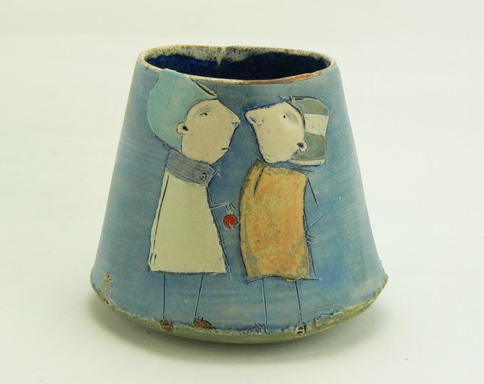 A Hand Built Ceramic Pot Illustrated With Two Figures and a Small Bird ...